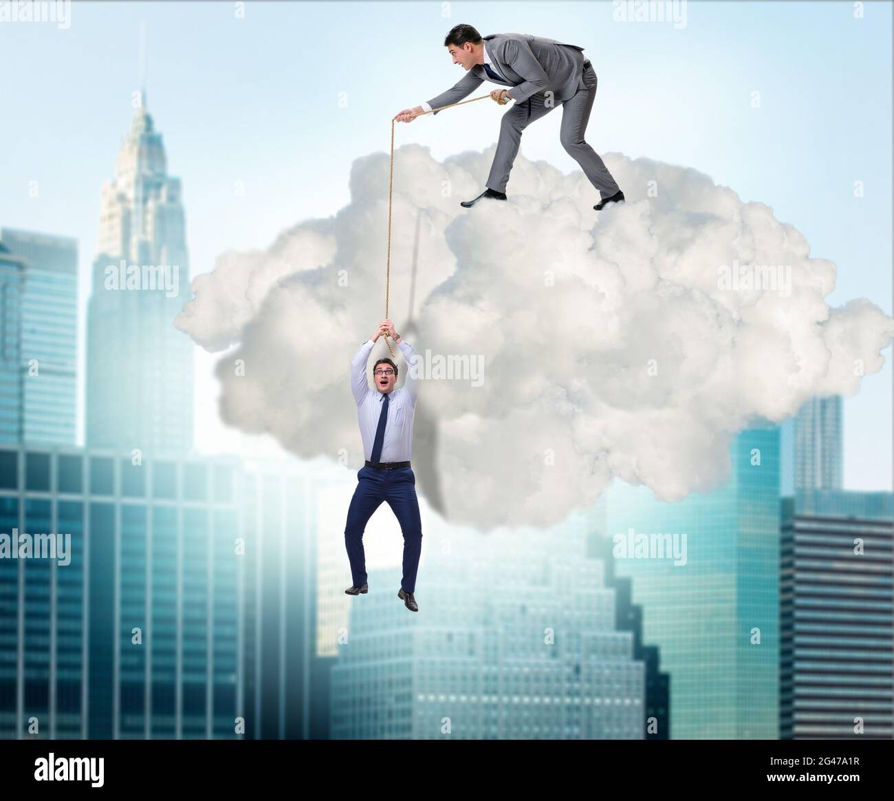 The businessman saving colleague by pulling rope Stock Photo - Alamy