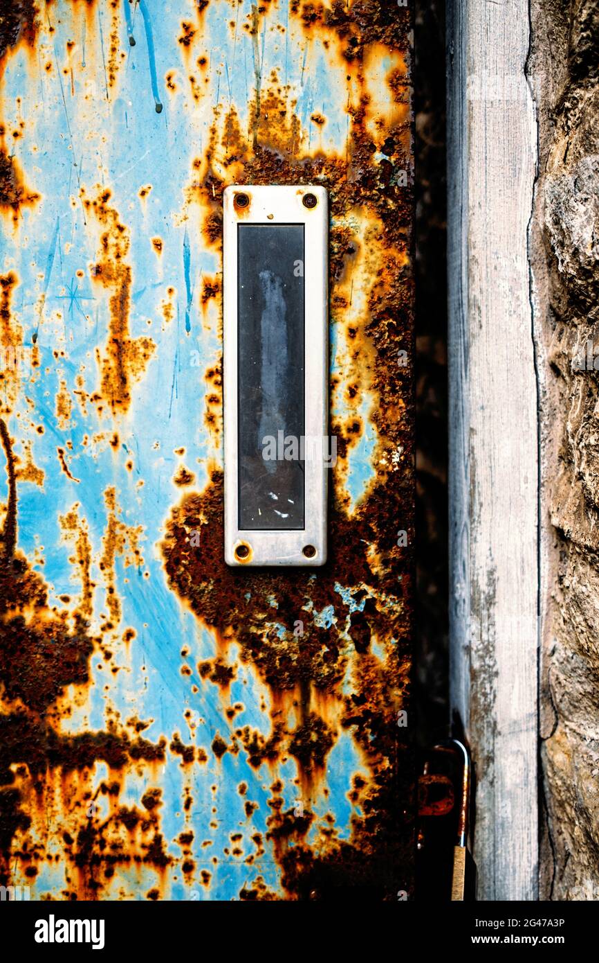 Old rusty letterbox on metal door Stock Photo - Alamy
