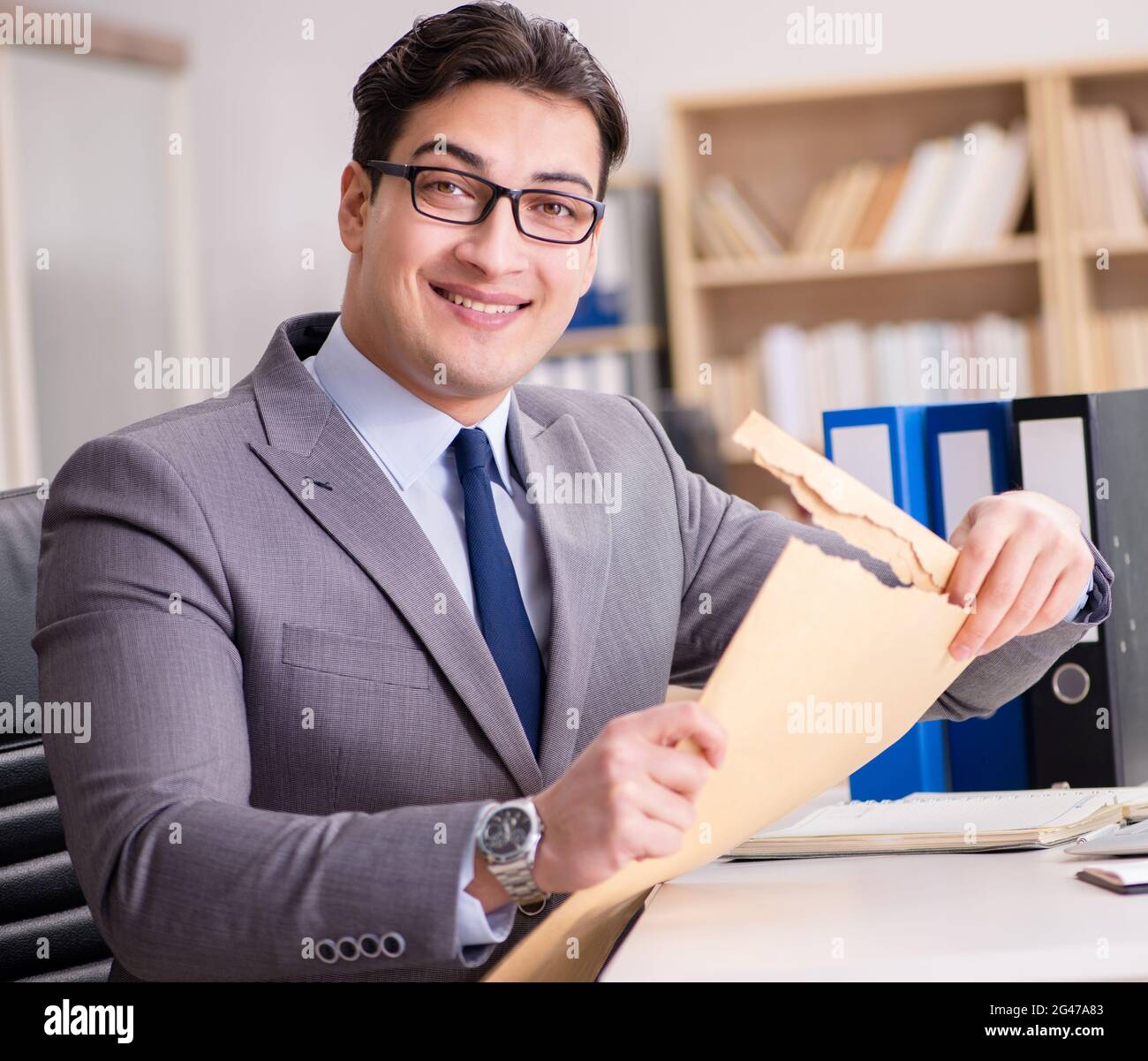 The businessman receiving letter in the office Stock Photo - Alamy