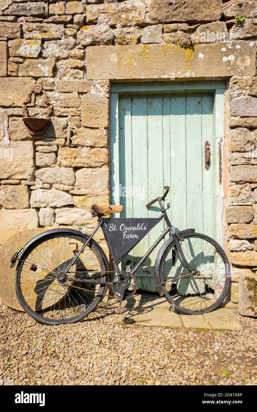 rustic scene of old bicycle on Northumberland farm Stock Photo - Alamy