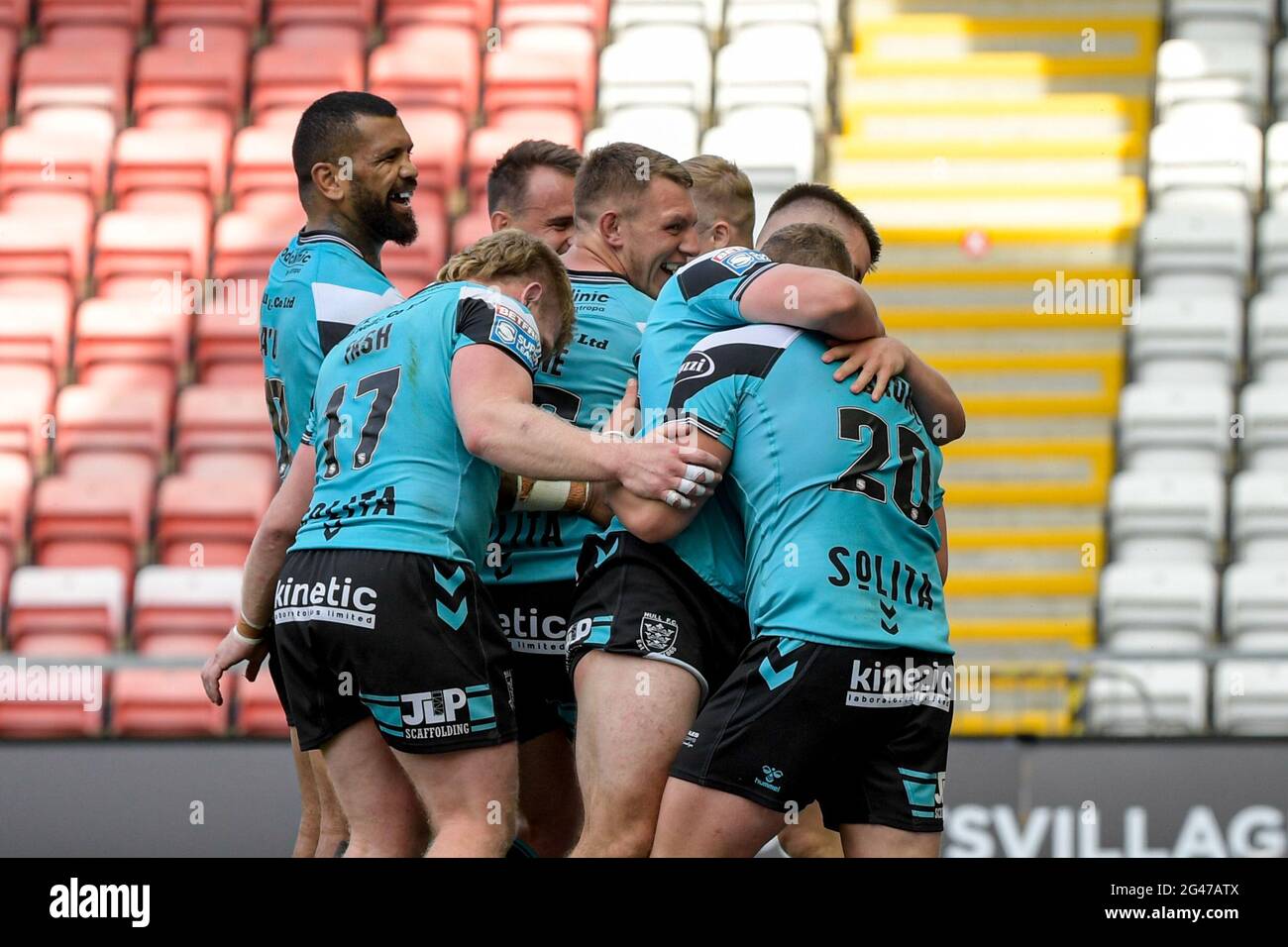 Jack Brown (20) of Hull FC celebrates scoring a try with his team mates ...