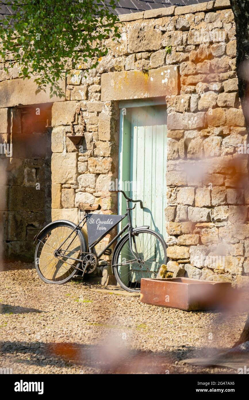 rustic scene of old bicycle on Northumberland farm Stock Photo - Alamy