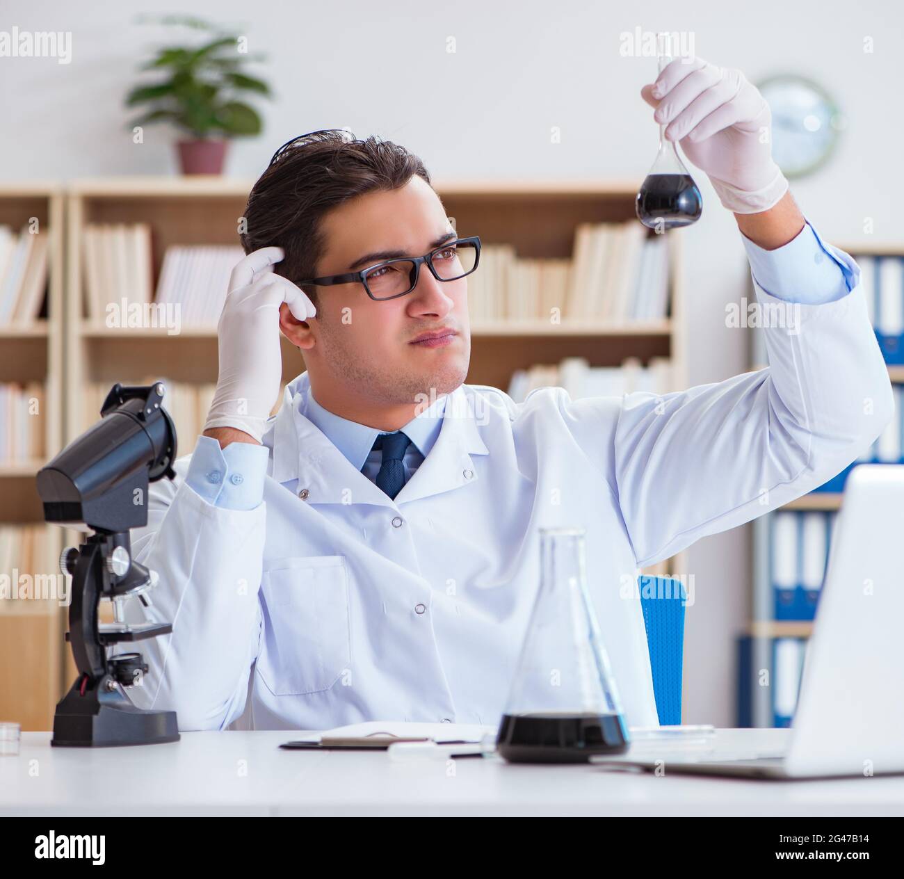 The chemical engineer working on oil samples in lab Stock Photo - Alamy