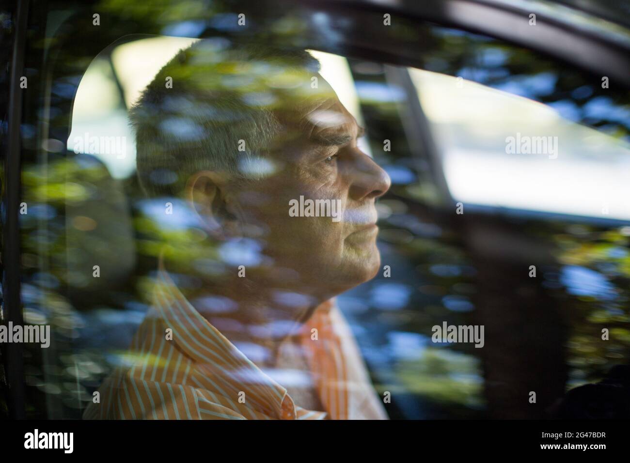 Man seen through car window Stock Photo - Alamy