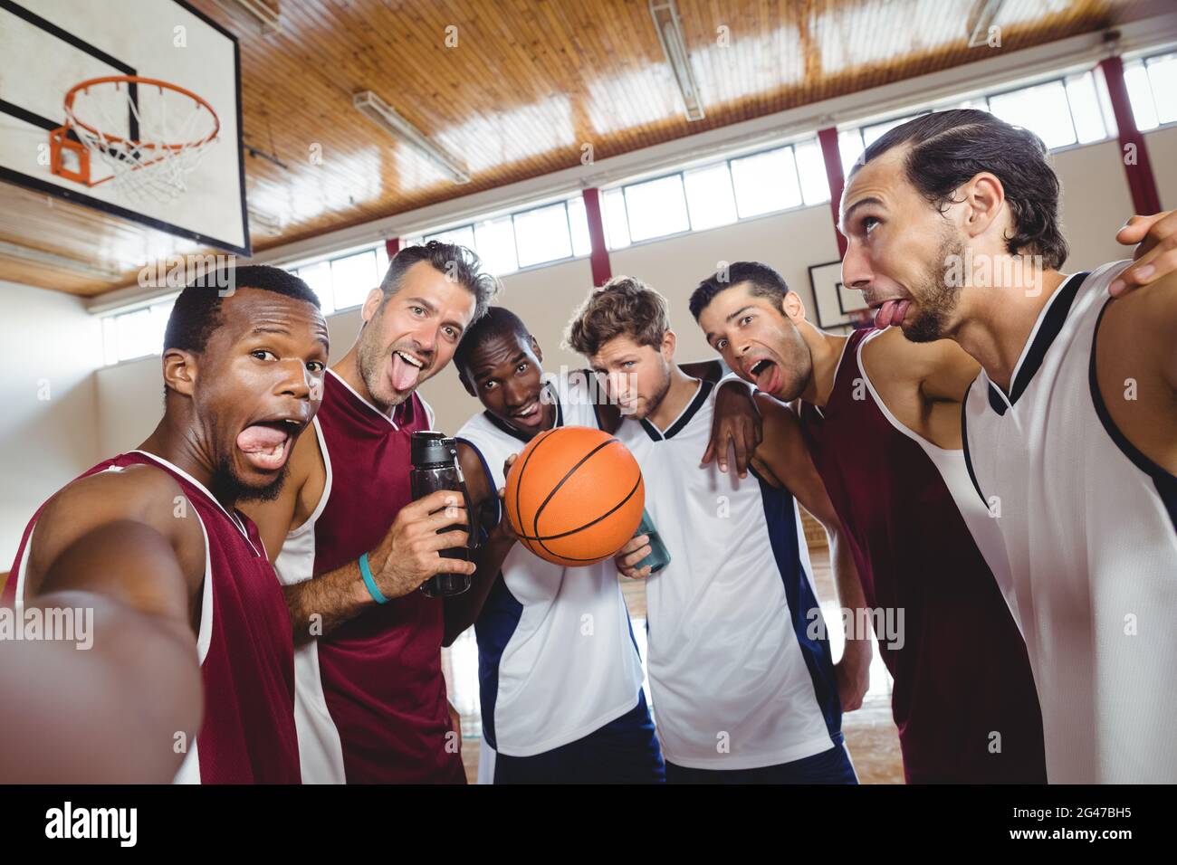 Happy basketball players making funny faces Stock Photo - Alamy