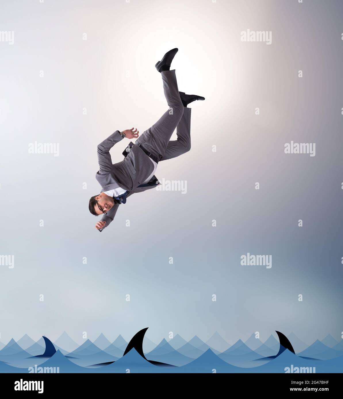The businessman falling into sea with sharks Stock Photo - Alamy