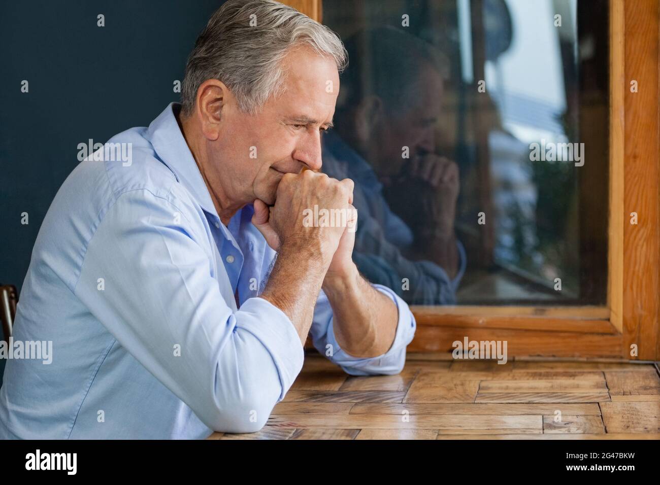 Worried man sitting in cafe hi-res stock photography and images - Alamy