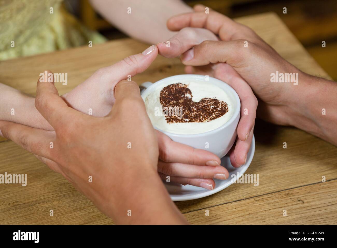 Hands around cup of coffee hi-res stock photography and images - Alamy