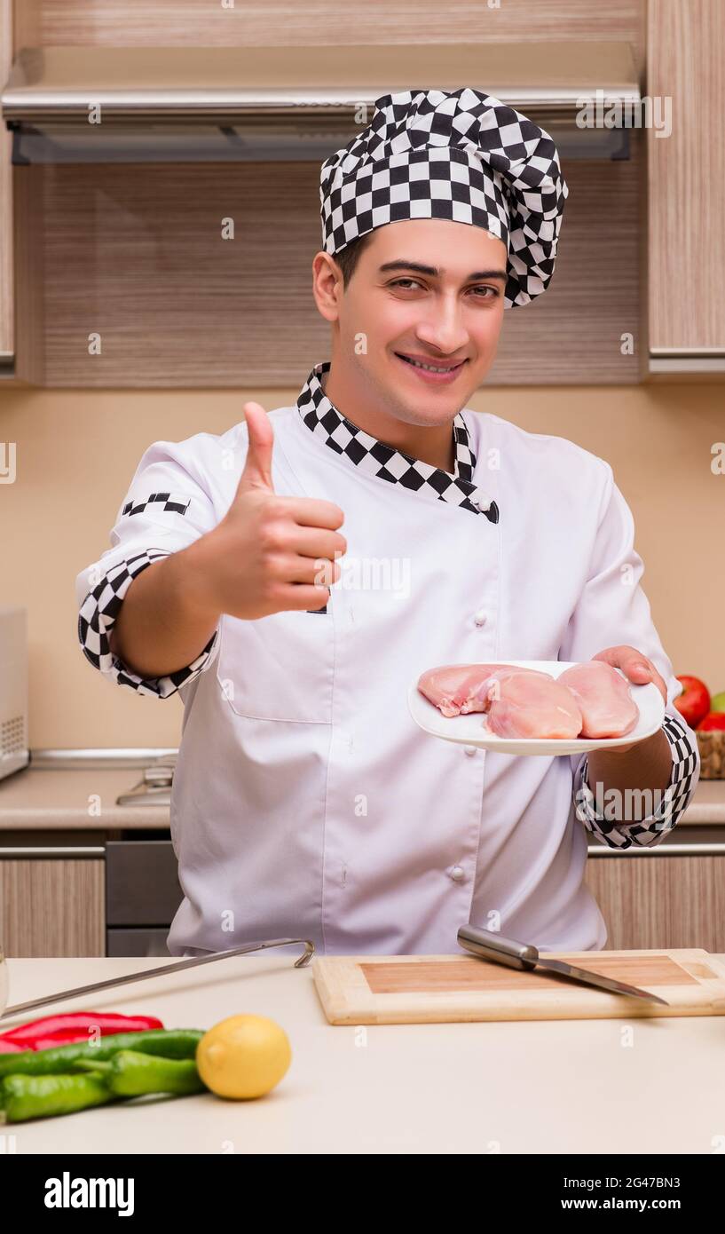 The young chef working in the kitchen Stock Photo - Alamy