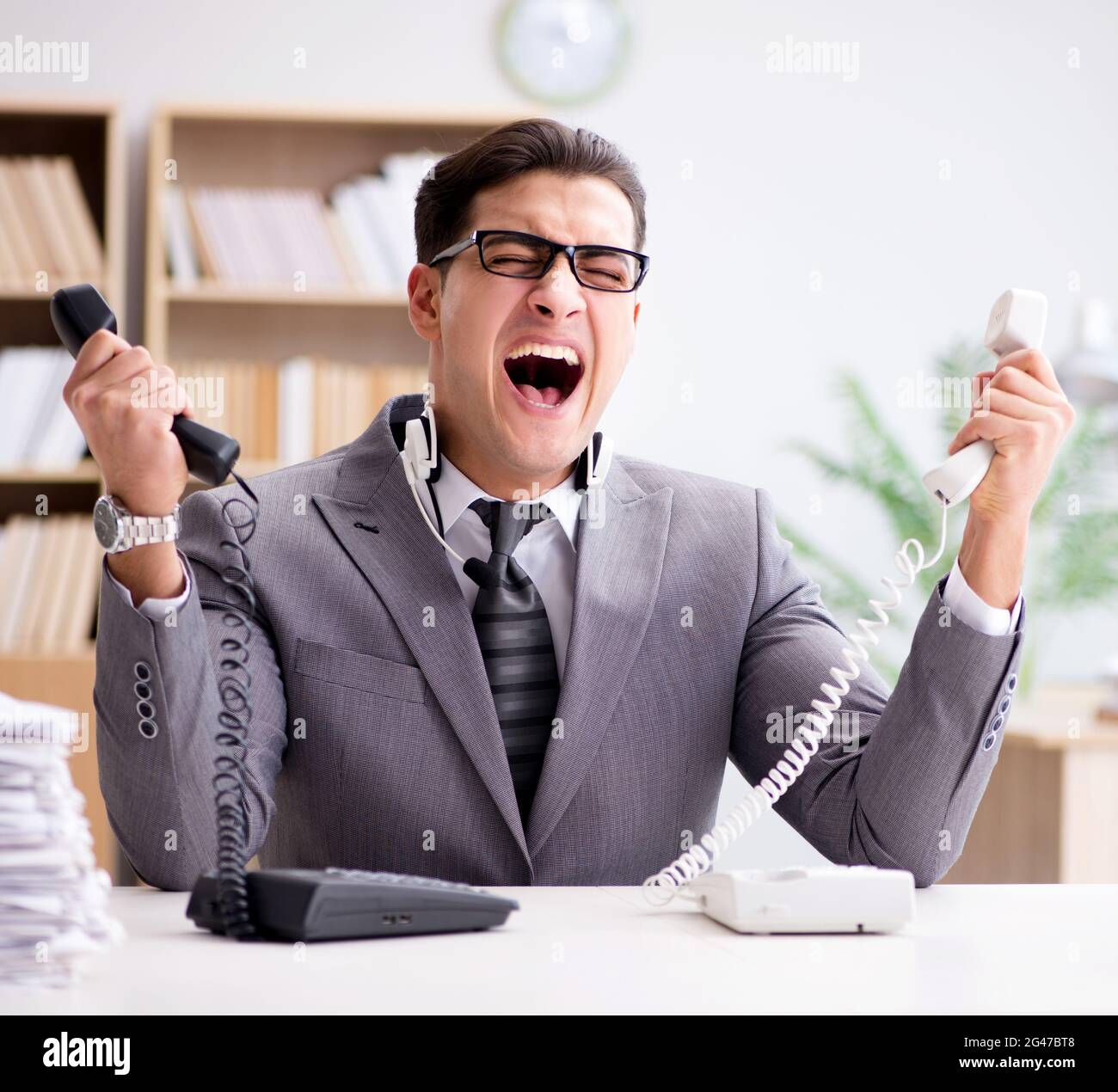 The angry helpdesk operator yelling in office Stock Photo - Alamy