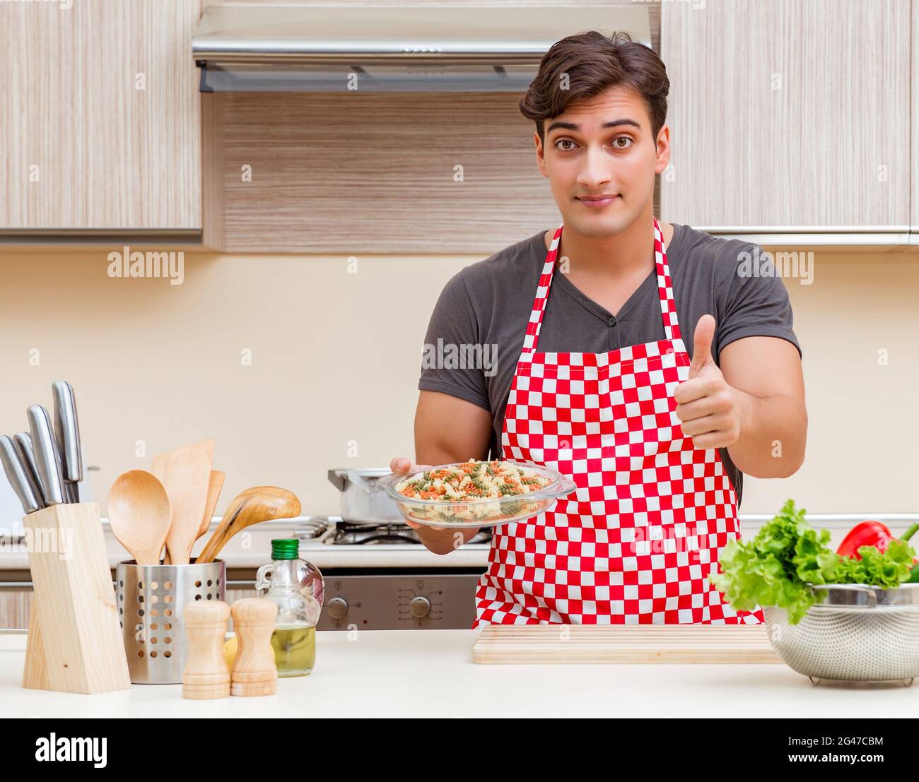 The man male cook preparing food in kitchen Stock Photo - Alamy