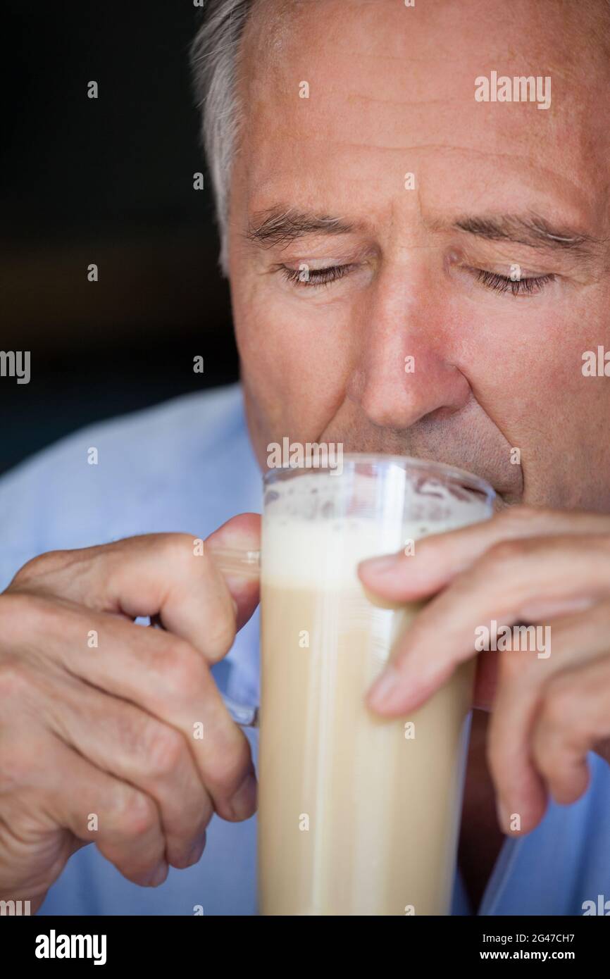 Man drinking cold coffee hi-res stock photography and images - Alamy