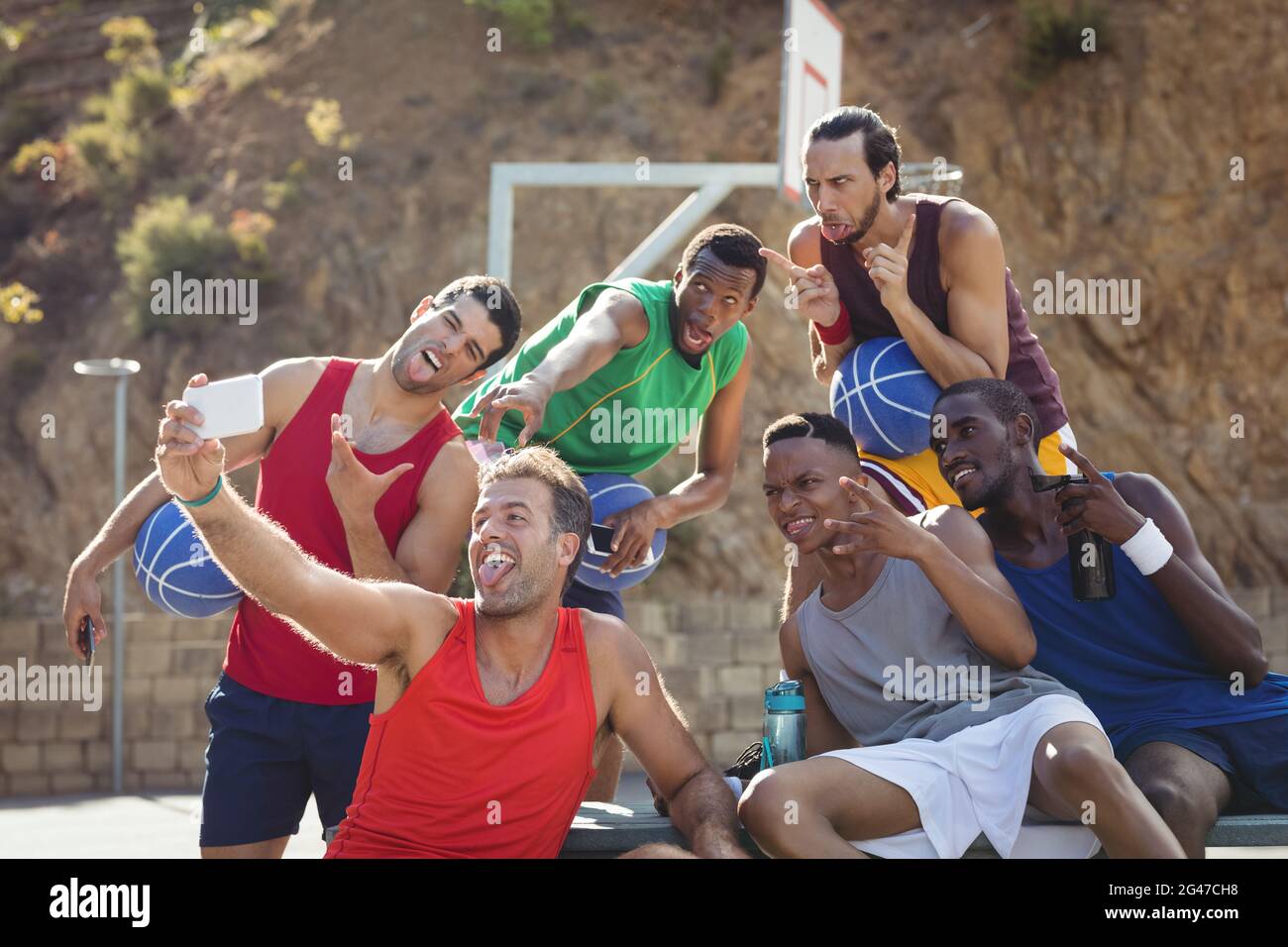 Basketball players taking a selfie Stock Photo - Alamy