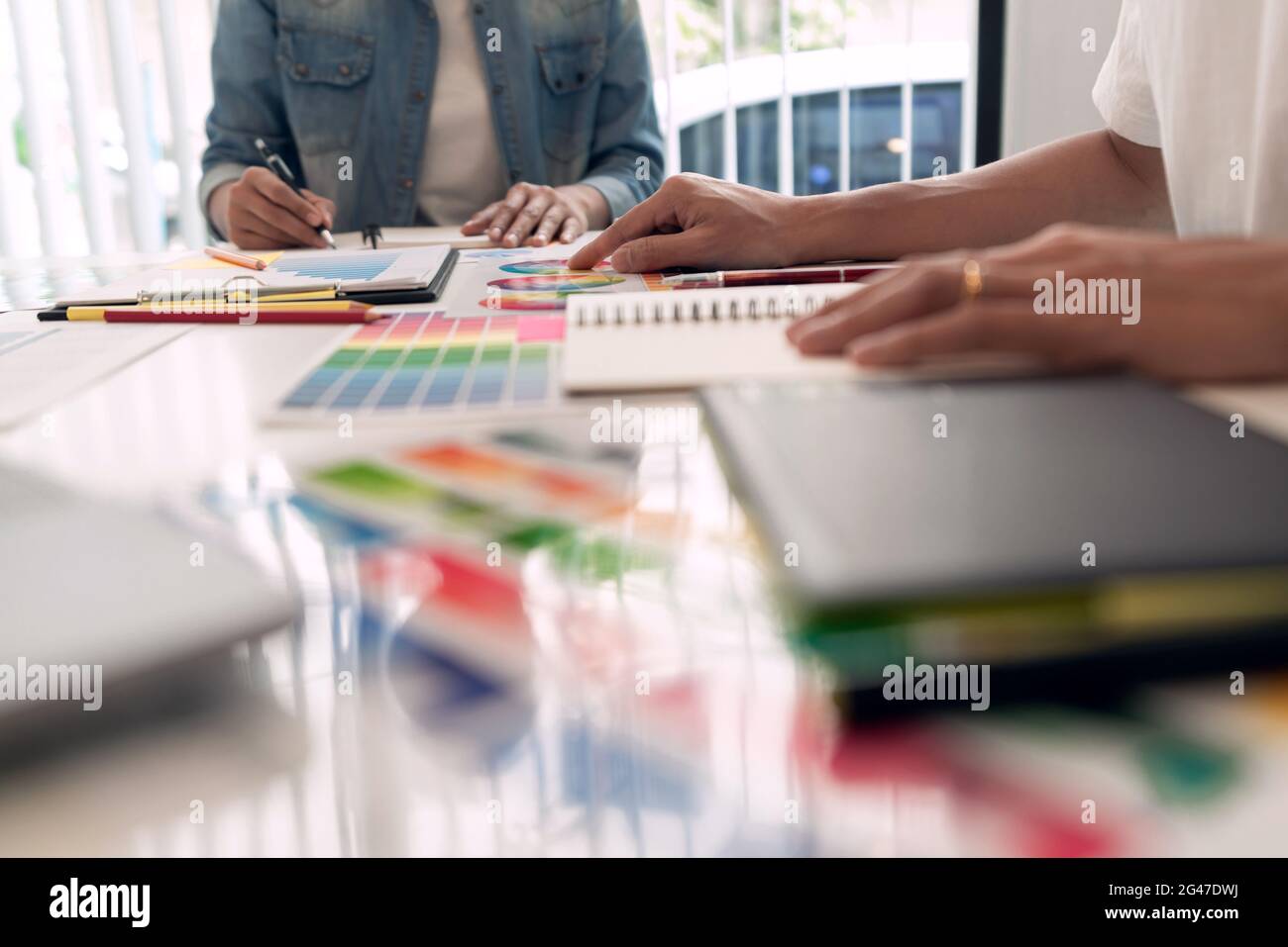 two designers discussing on the color tone for the excellent visual ...