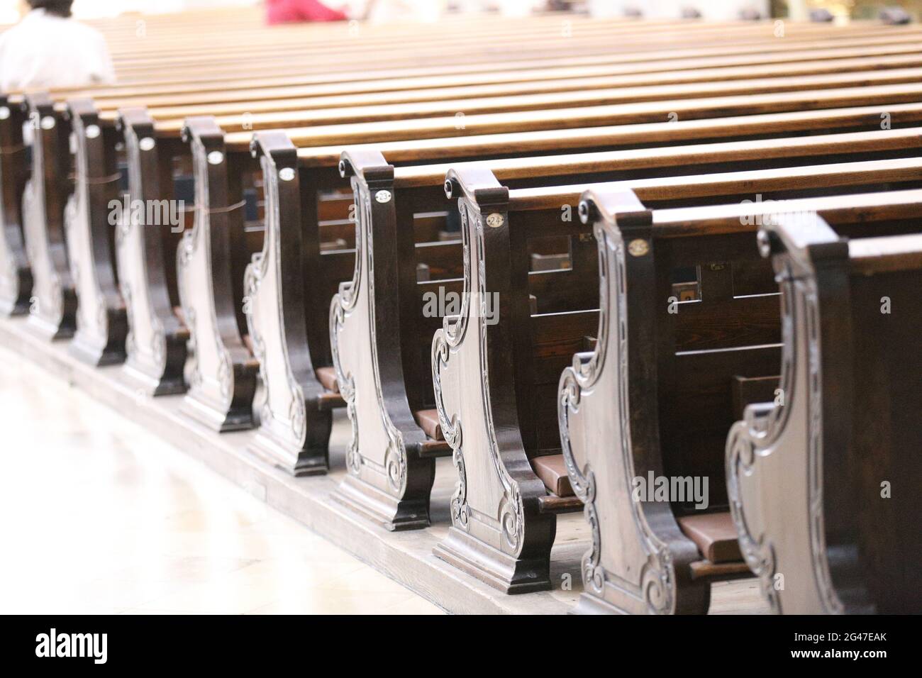 Pews in rows in the church with people sitting in them Stock Photo - Alamy