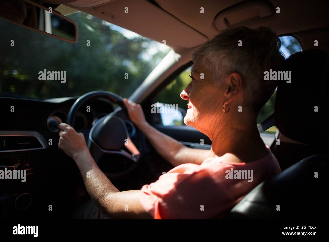 Senior woman driving car Stock Photo - Alamy