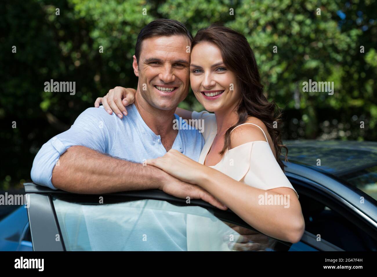 Happy people leaning driving car hi-res stock photography and images ...