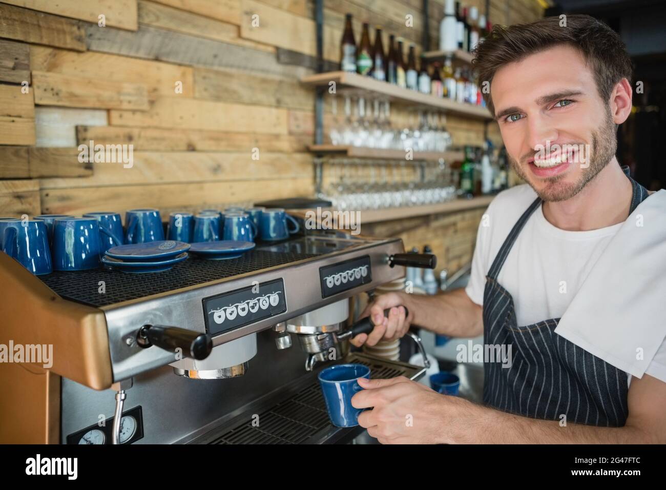 Portrait smiling waiter preparing hi-res stock photography and images ...