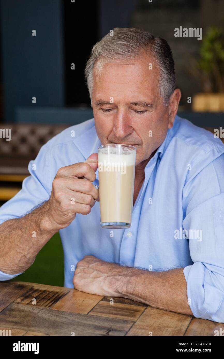 Man drinking cold coffee hi-res stock photography and images - Alamy