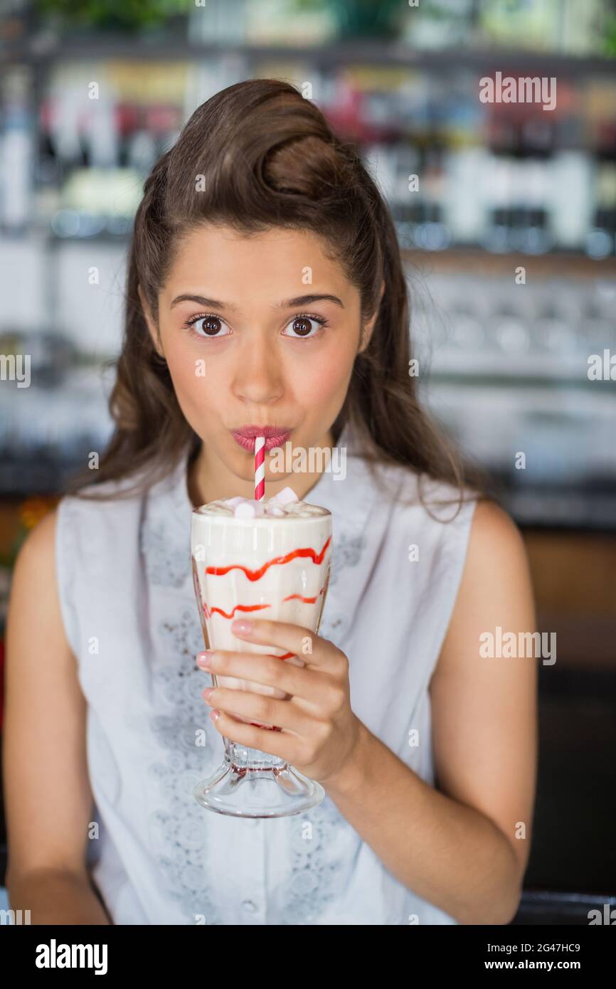 Portrait happy woman drinking milkshake hi-res stock photography and ...
