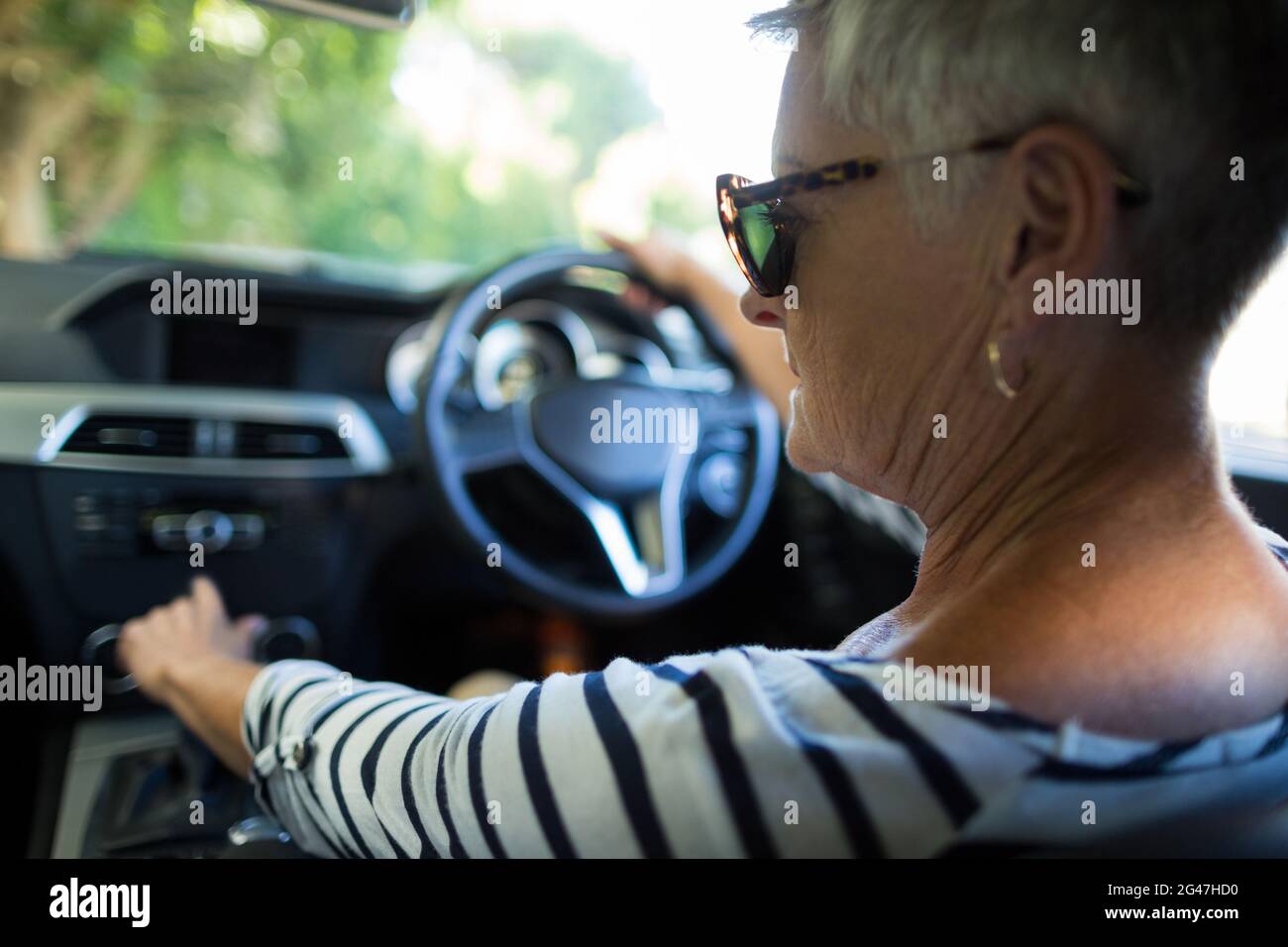Serious senior woman driving car Stock Photo - Alamy