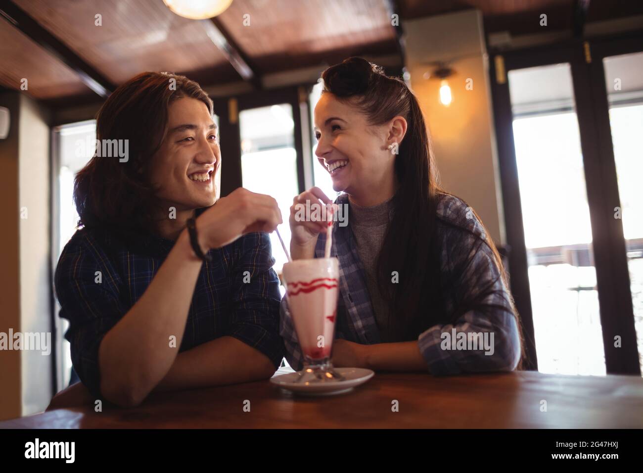 Young Couple Sharing Milkshake High Resolution Stock Photography and ...