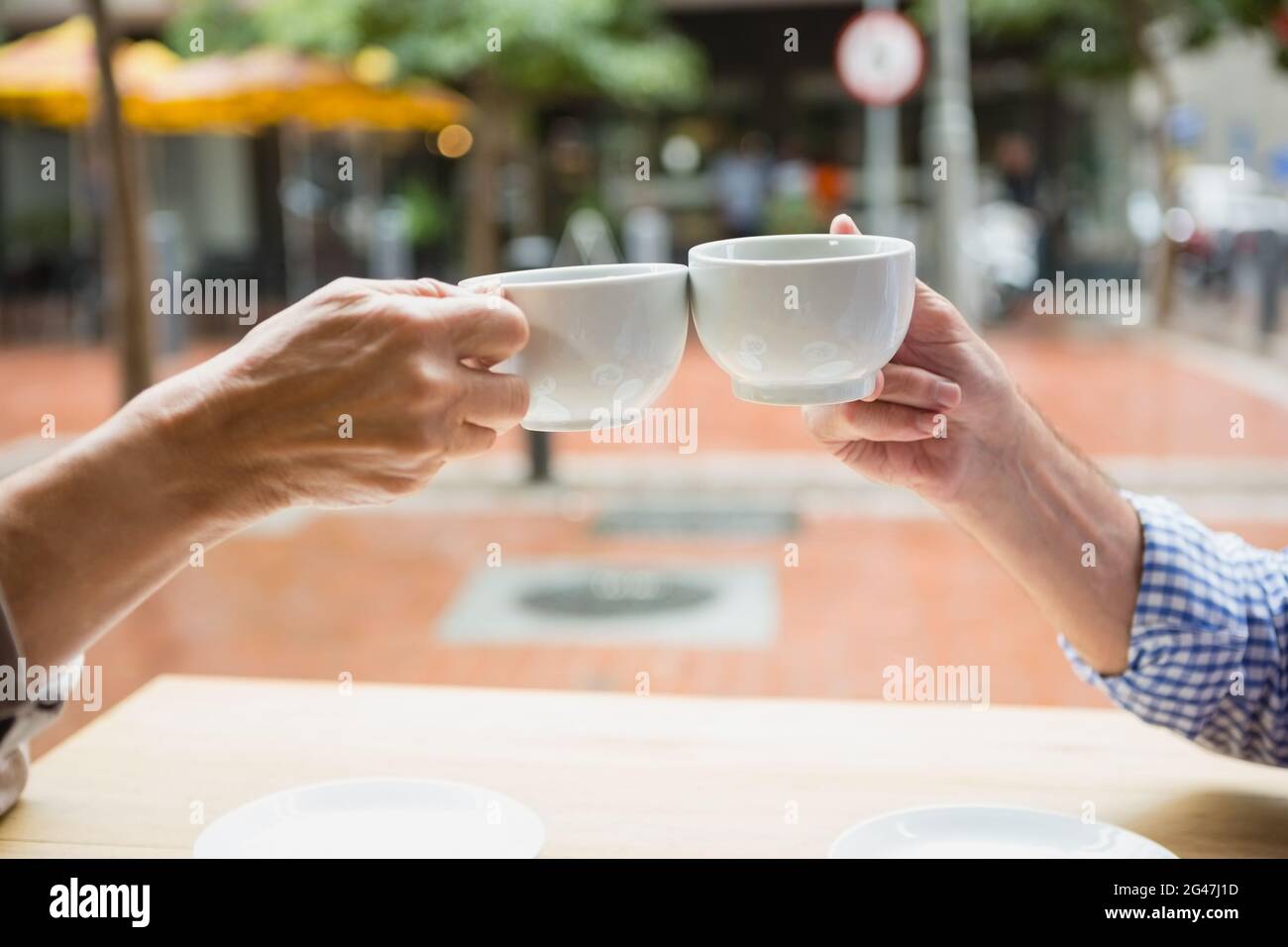 Hands toasting cups hi-res stock photography and images - Alamy