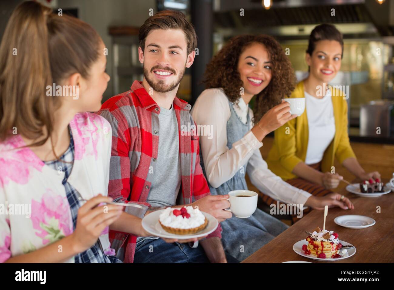 Female friends holding chocolate hi-res stock photography and images ...