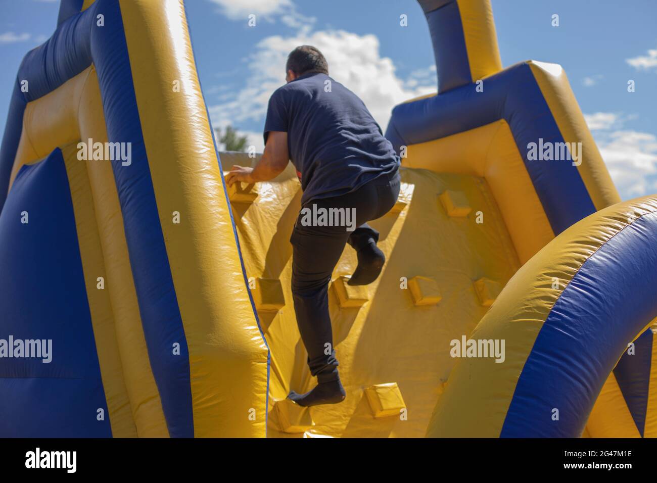 The guy on the inflatable slide. Fun rest and sports. Competition on an ...