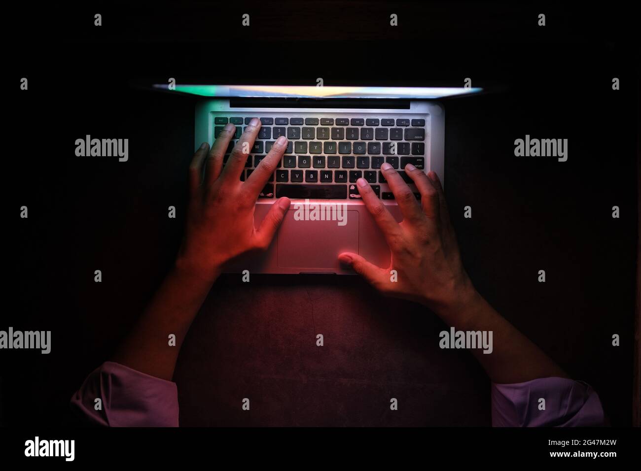 hacker hand stealing data from laptop top down Stock Photo - Alamy
