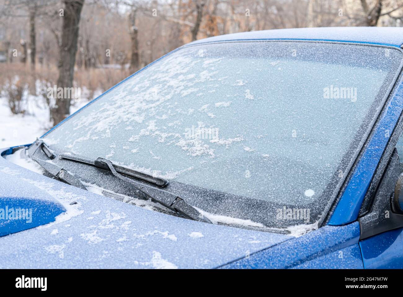 car window glass under the frozen ice, cold winter problems concept ...