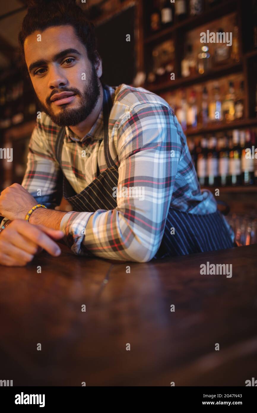 Portrait of waiter leaning at counterÃ‚Â Stock Photo - Alamy