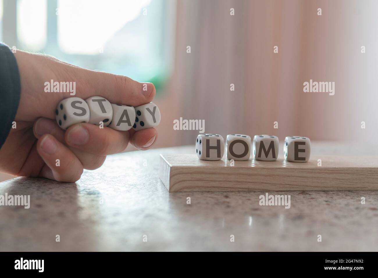 stay safe at home during quarantine. dice cubes with text, simple ...