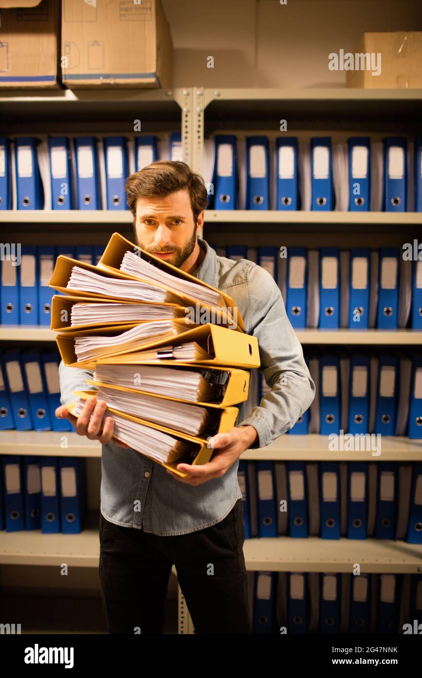 Businessman holding files hi-res stock photography and images - Alamy