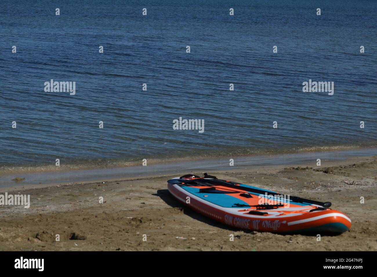 Paddleboard on a beach by the sea in Cyprus Stock Photo - Alamy