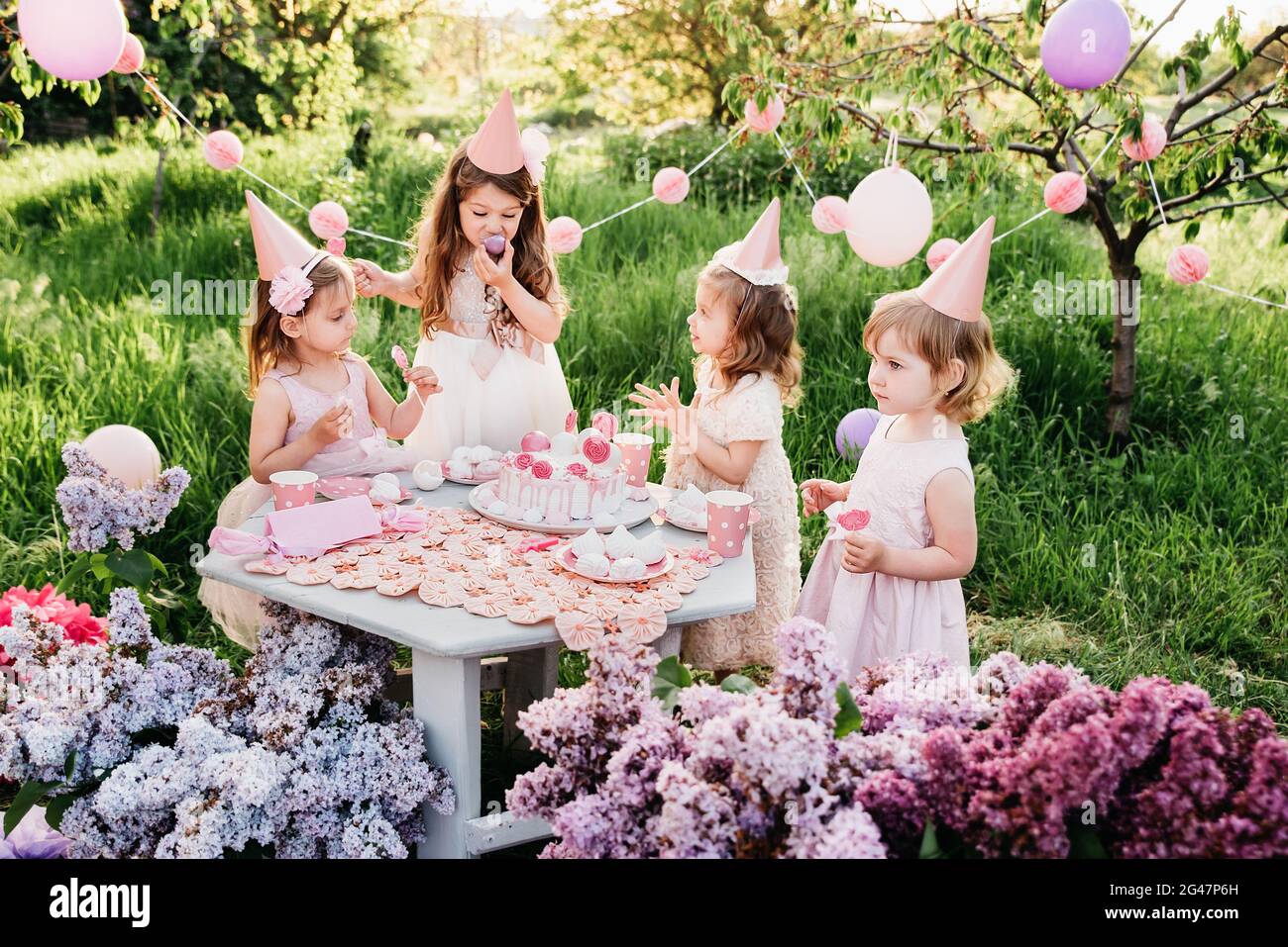Summer outdoor kids birthday party. Group of happy Children celebrating ...