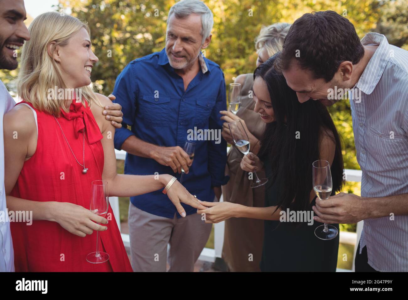 Woman showing ring to friends hi-res stock photography and images - Alamy