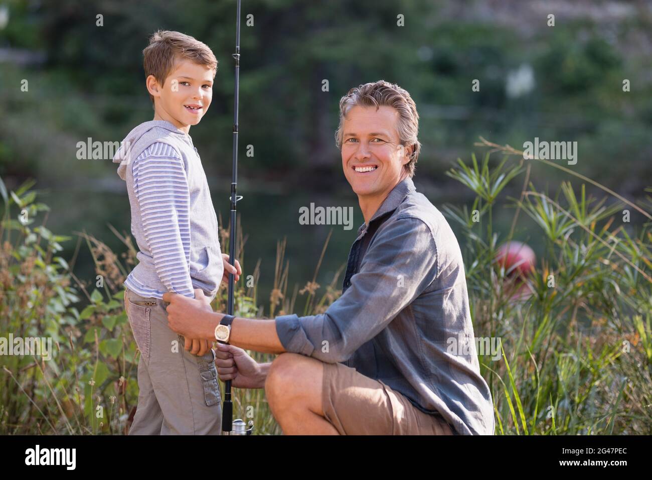 Father son fishing rod standing hi-res stock photography and images - Alamy