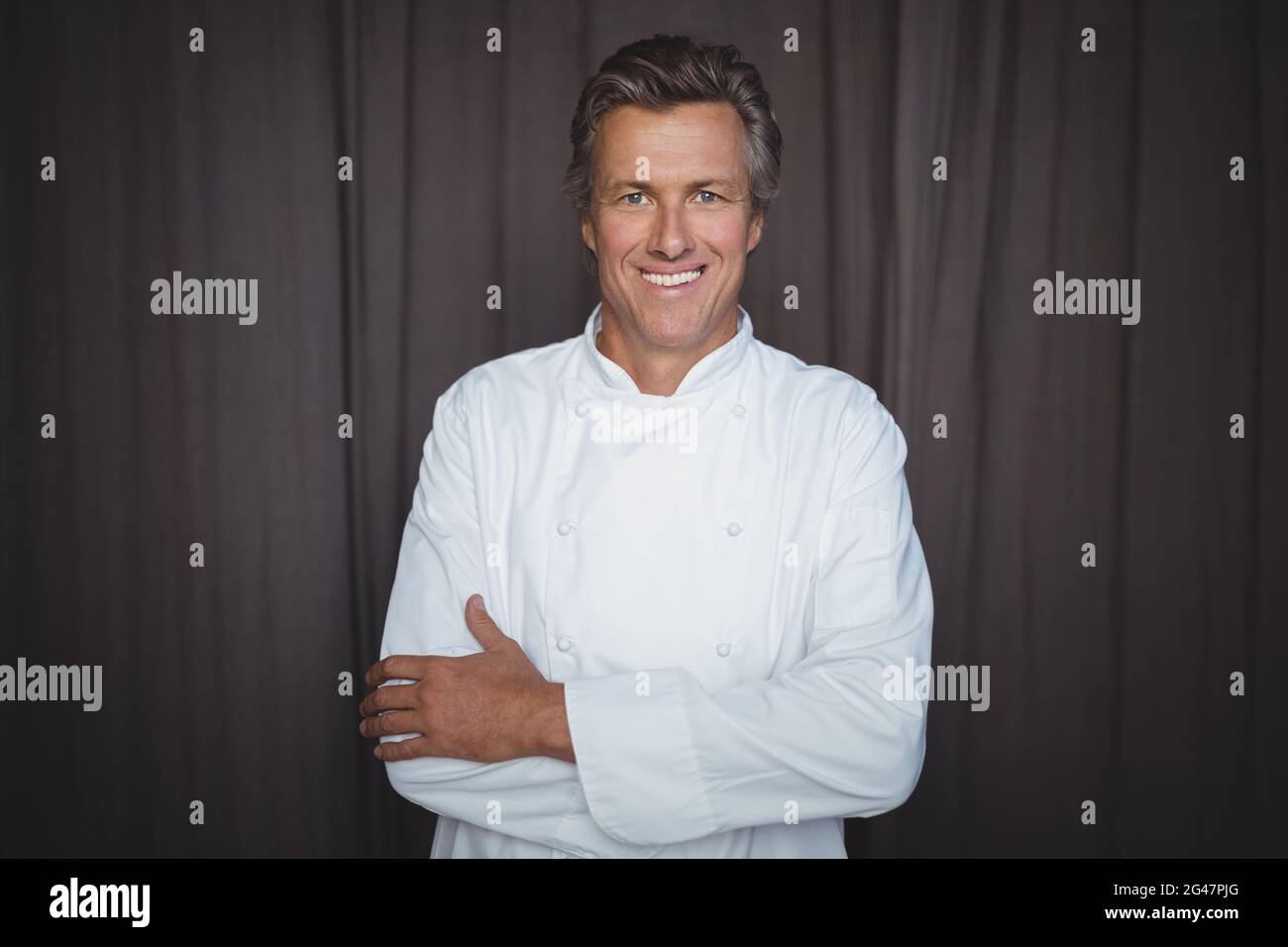 Handsome chef crossed arms hi-res stock photography and images - Alamy