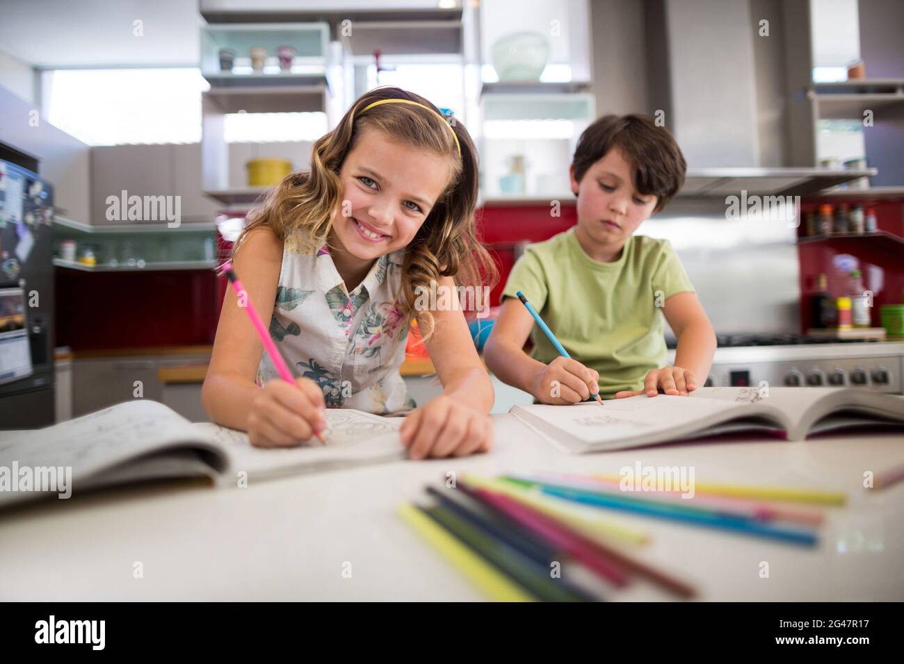 Brother sister doing homework in hi-res stock photography and images ...