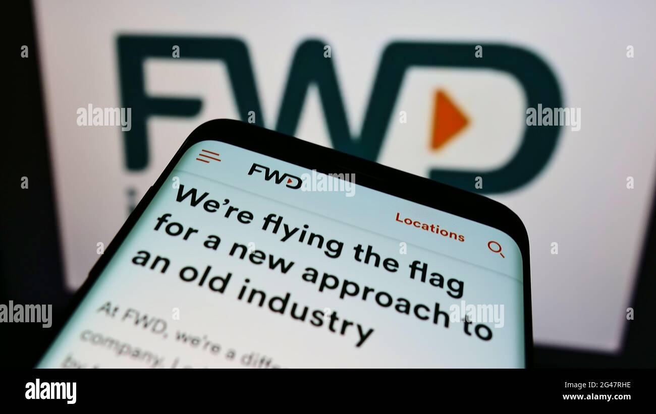 Mobile phone with website of Hong Kong insurance company FWD Group on ...