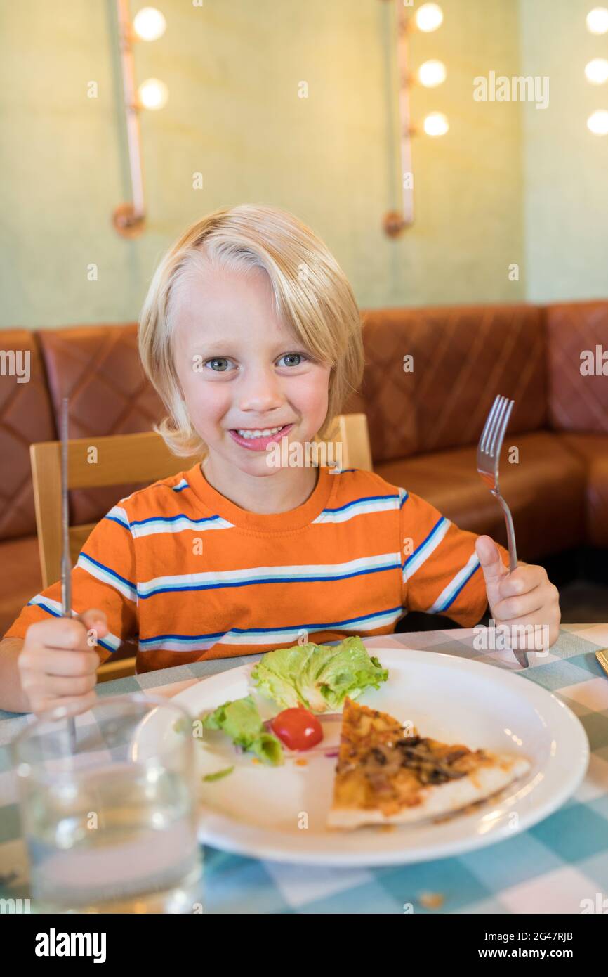 Restaurant food and drink sitting eating childhood holding hi-res stock ...