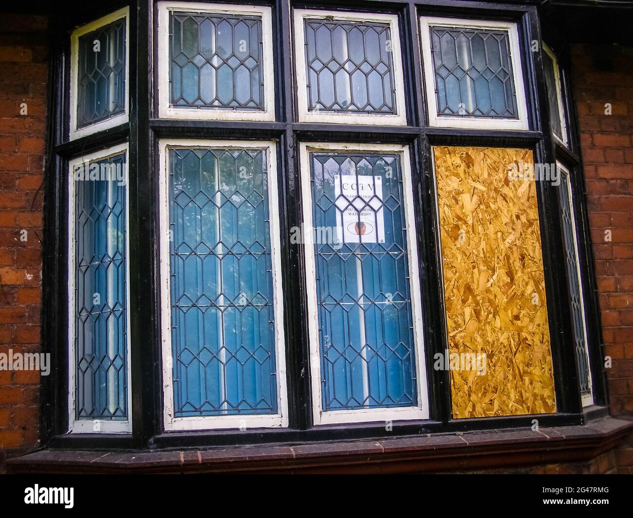 A window with one glass blocked with a wood board Stock Photo - Alamy