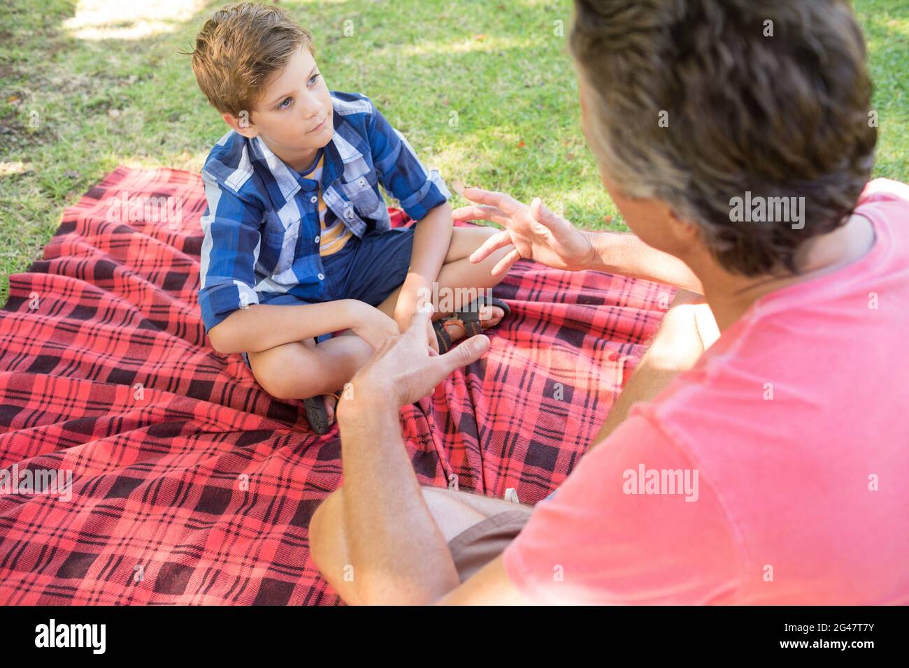 Father son talking in park hi-res stock photography and images - Alamy