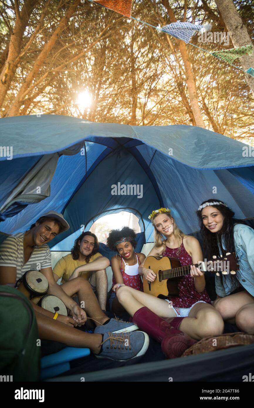 Portrait of friends in tent hi-res stock photography and images - Alamy