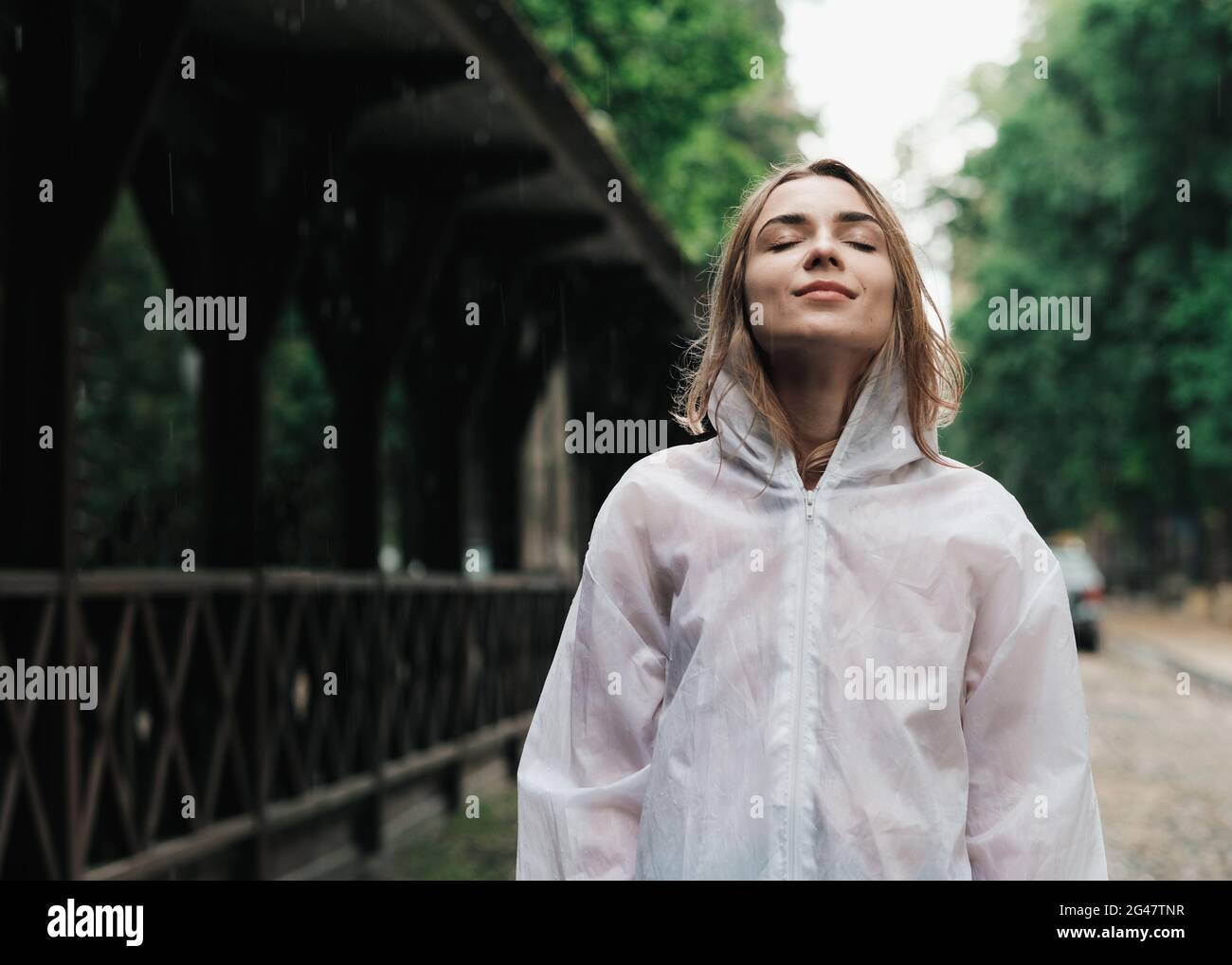 Female raincoat hi-res stock photography and images - Alamy