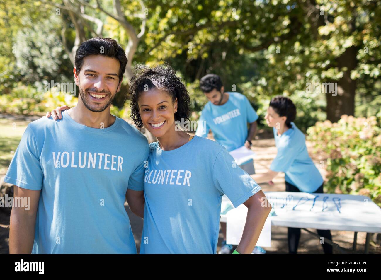 Female male volunteers hugging in hi-res stock photography and images ...