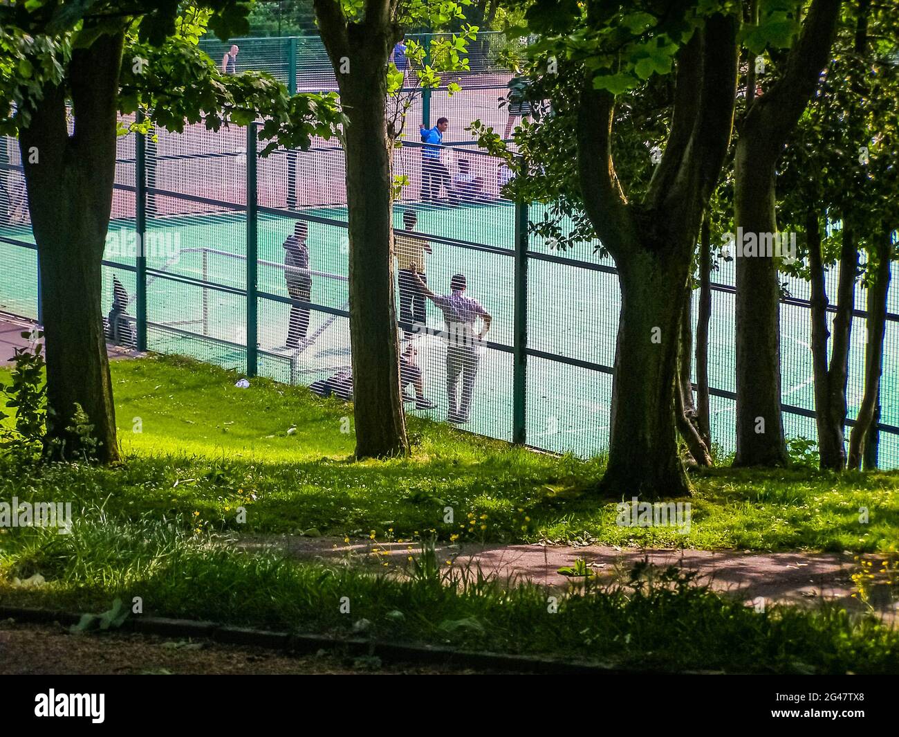 STOKE ON TRENT, ENGLAND – 3 MAY 2008:Men playing football in Hanley ...
