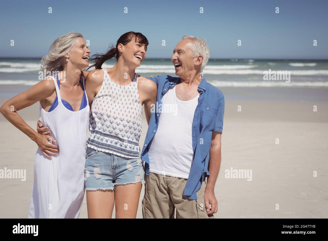 Father and daughter standing at beach hi-res stock photography and ...