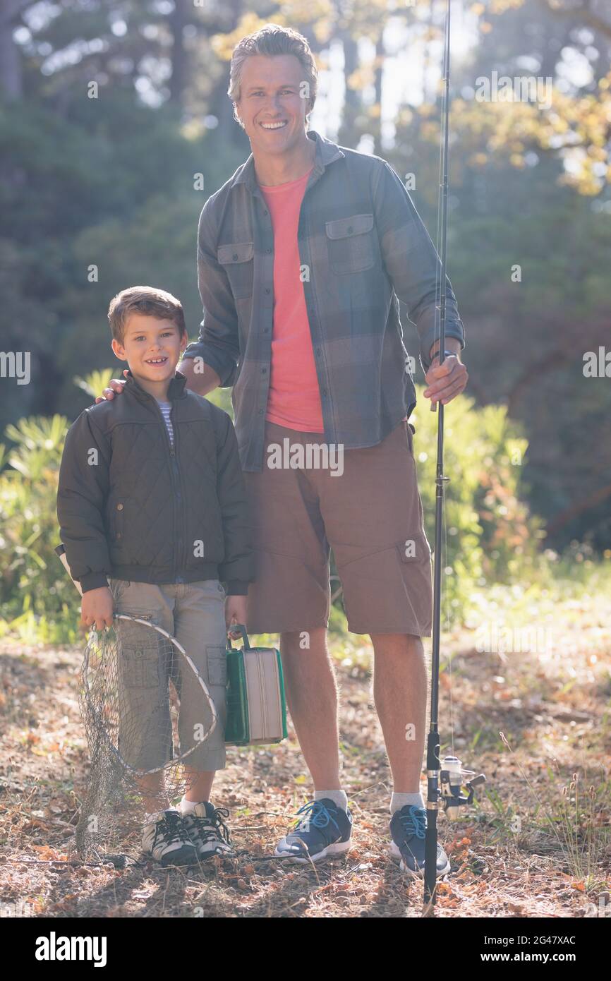 Father son fishing rod standing hi-res stock photography and images - Alamy